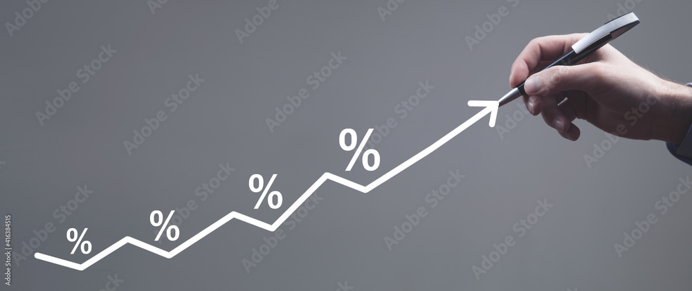 Male hand drawing arrow and percent symbols. Stock Photo | Adobe Stock