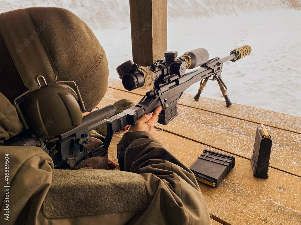 Army sniper looking through the scope. Snipers images. The sniper lies ...