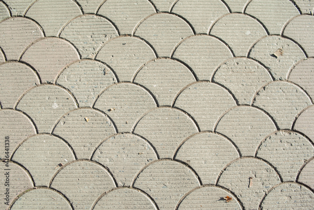 Texture of stone paving stones. Cobblestone arched pavement road at the ...