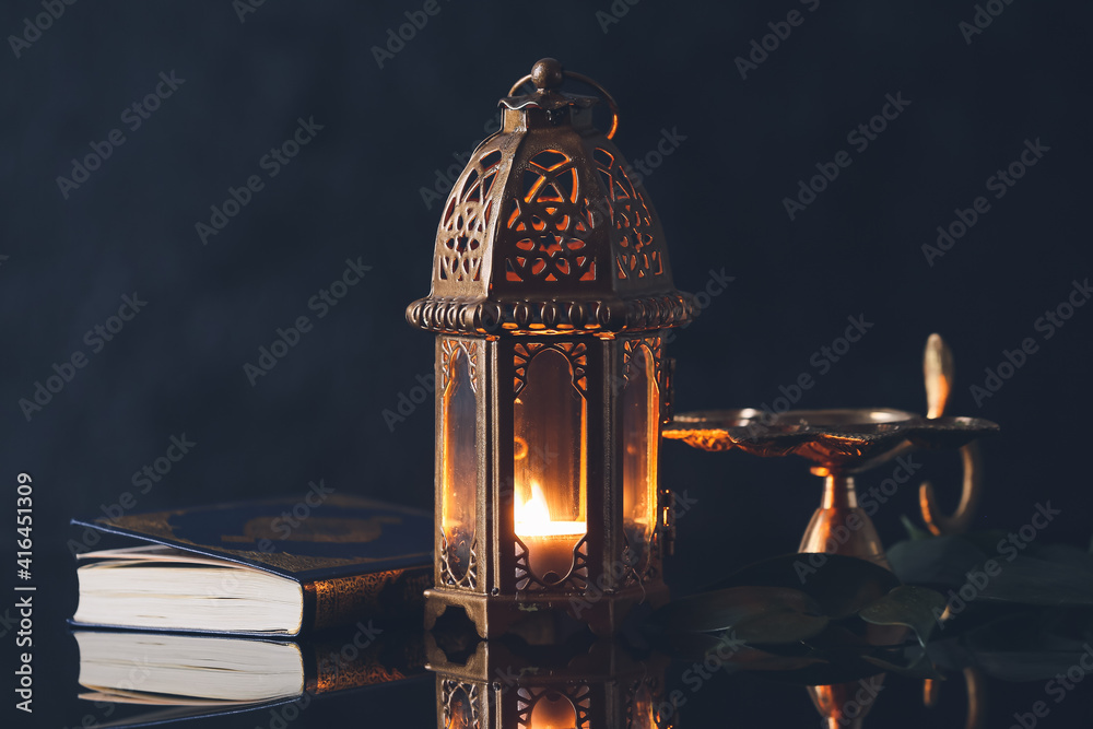 Muslim lamp and Koran on dark background Stock Photo | Adobe Stock