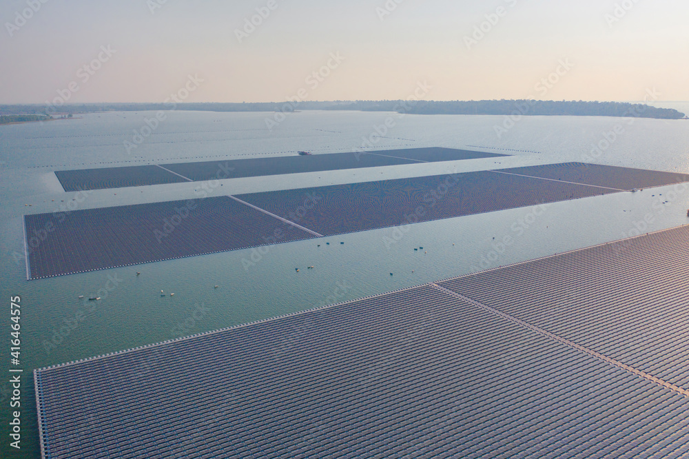 Aerial top view of solar panels or solar cells on buoy floating in lake ...