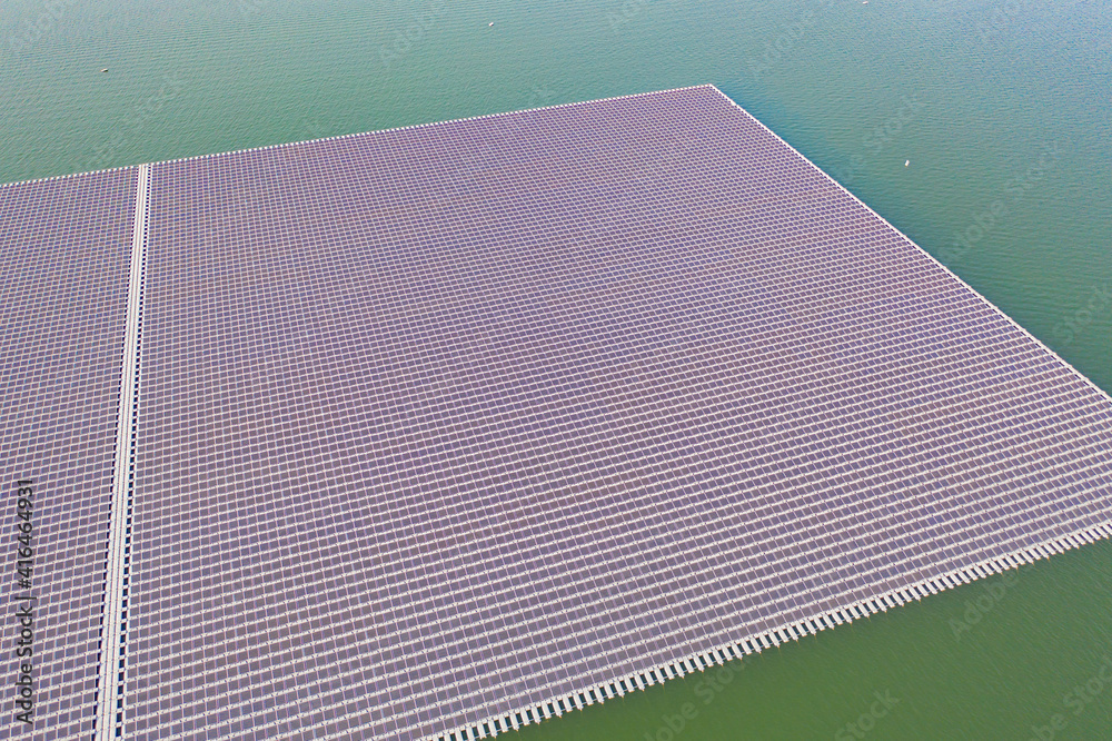 Aerial top view of solar panels or solar cells on buoy floating in lake ...