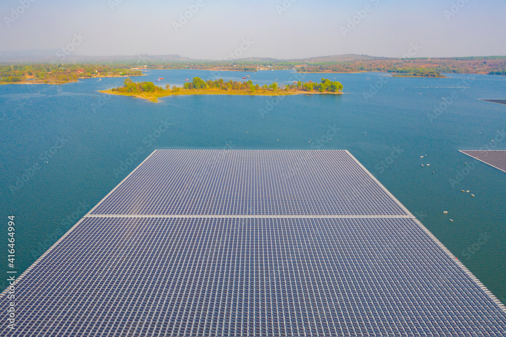 Aerial top view of solar panels or solar cells on buoy floating in lake ...