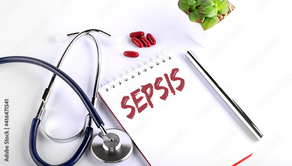 Text SEPSIS on a white background with pills and stethoscope. Medical ...