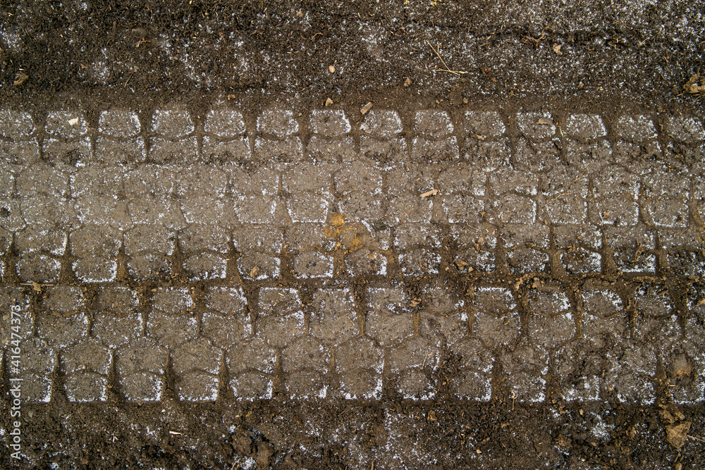 Wheel tracks on the soil. Tire tracks on the ground. Soil texture ...