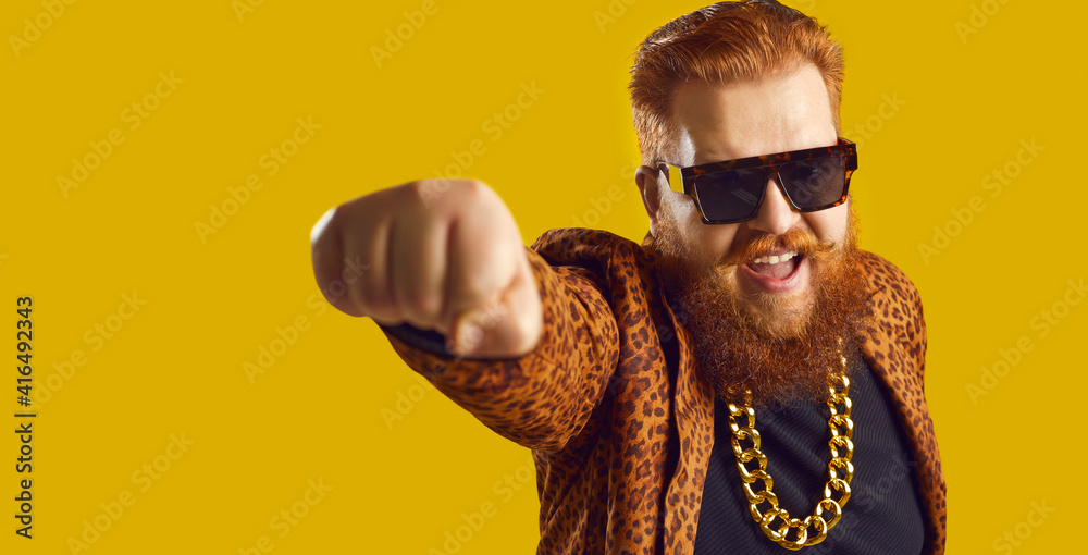 Shouting young man with ginger beard and handlebar mustache in funky ...