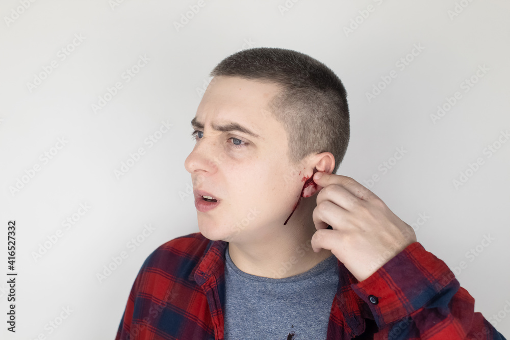 A man whose ear is bleeding. Vascular rupture, damage to the tympanic ...