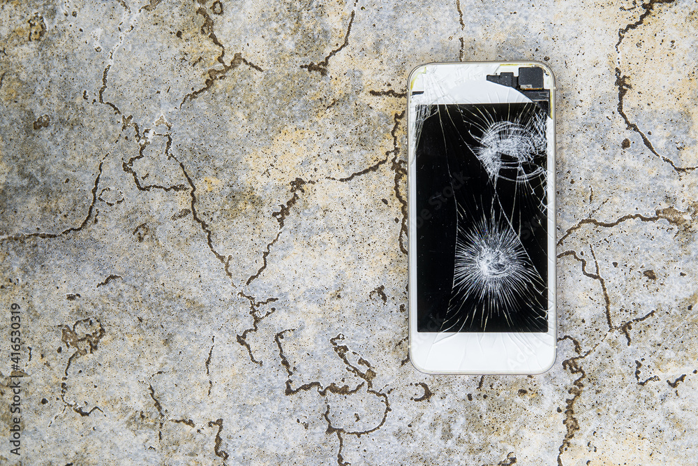 Screen cracked smartphone. Mobile phone with damaged touchscreen ...