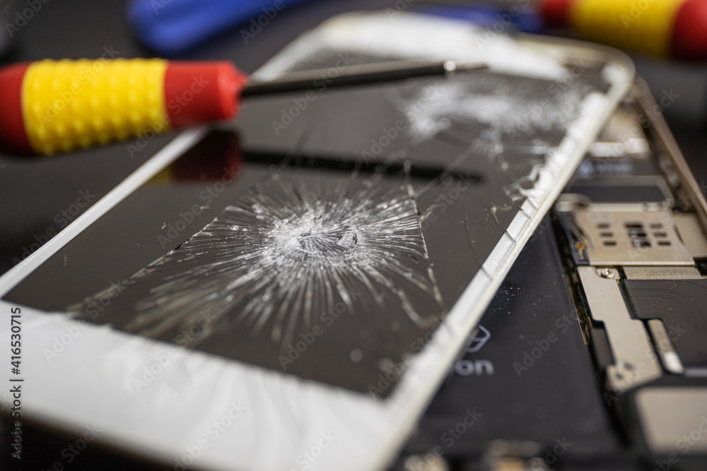 Screen cracked smartphone. Mobile phone with damaged touchscreen ...