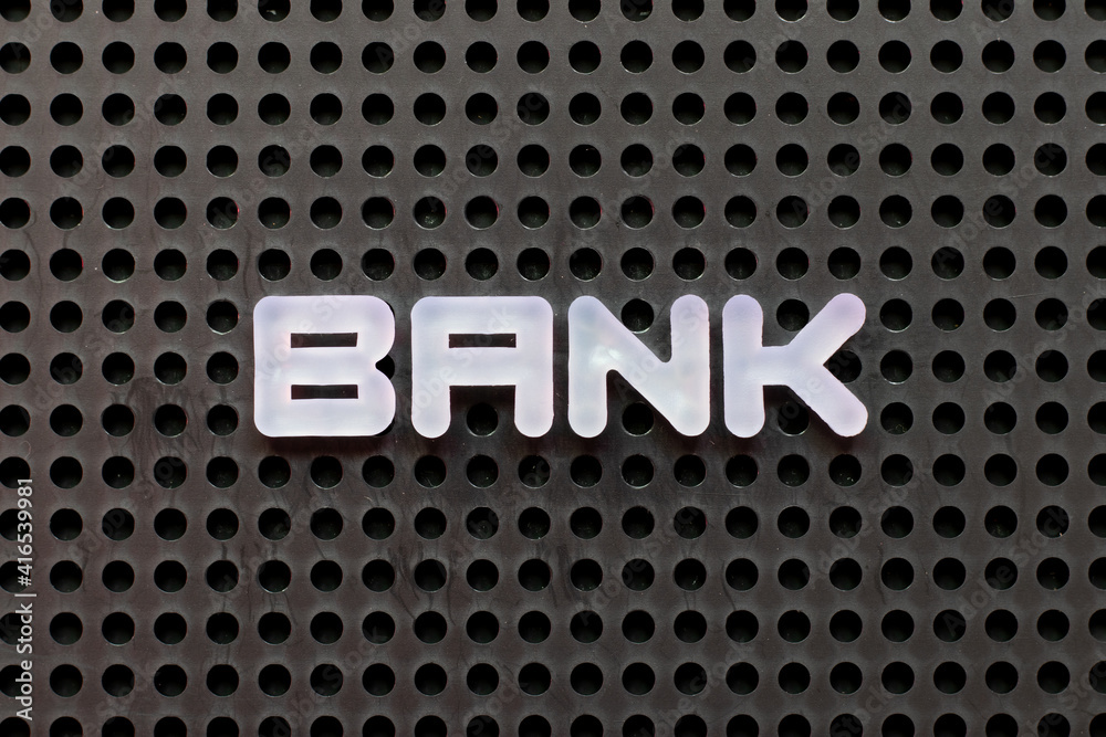 White color letter in word bank on black pegboard background Stock ...