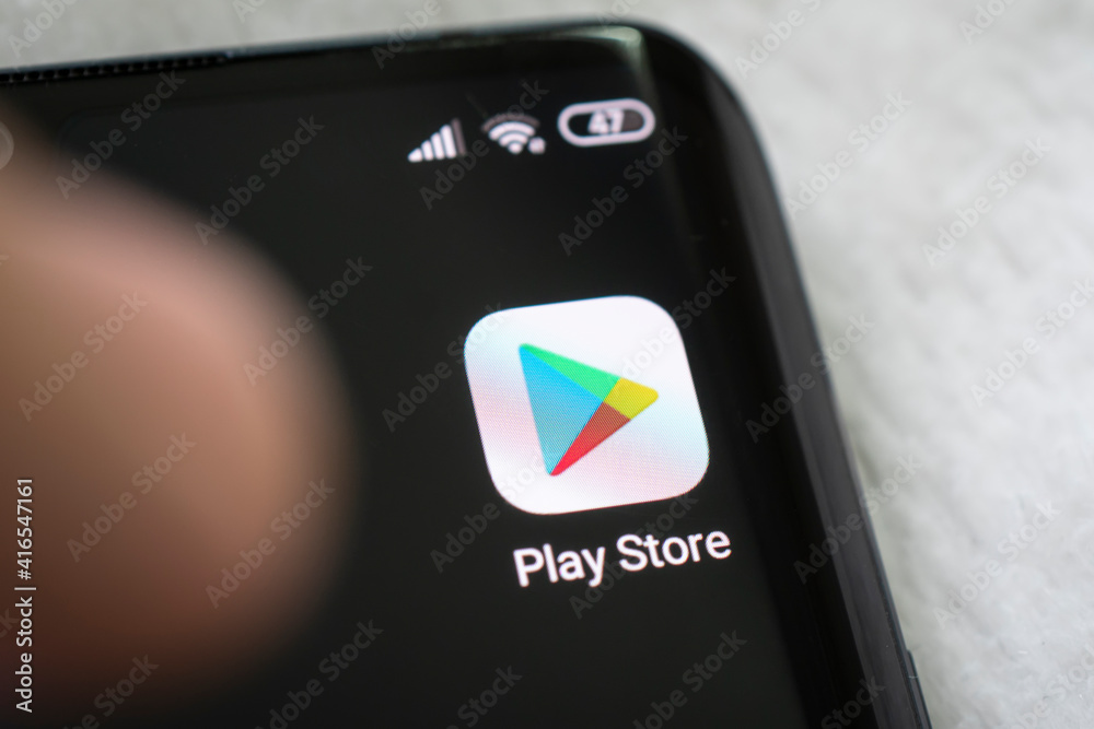 Google play store app on the screen of a black smartphone. Stock Photo ...