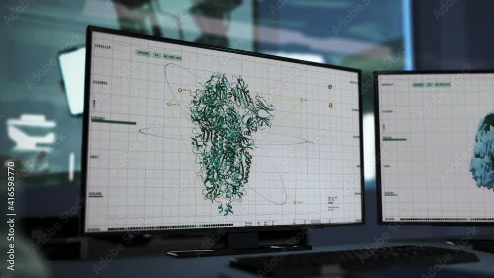Inside a laboratory. Two computer screens with keyboard on a desk ...