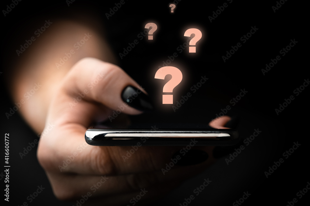 Question marks with person holding smartphone. Find answer online, FAQ ...