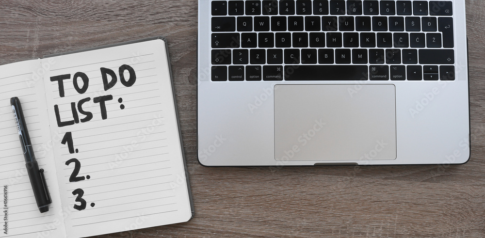 TO DO List, laptop on desk. Wooden table, working from home concept of ...