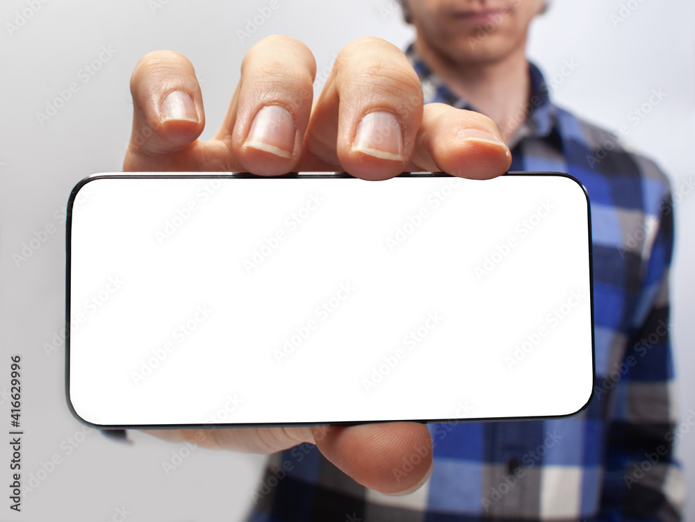hand showing horizontal smartphone with white blank screen isolated on ...