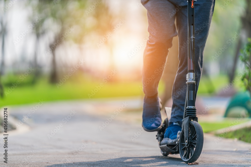 Poster outdoors workout exercise background of man ridding on kick ...