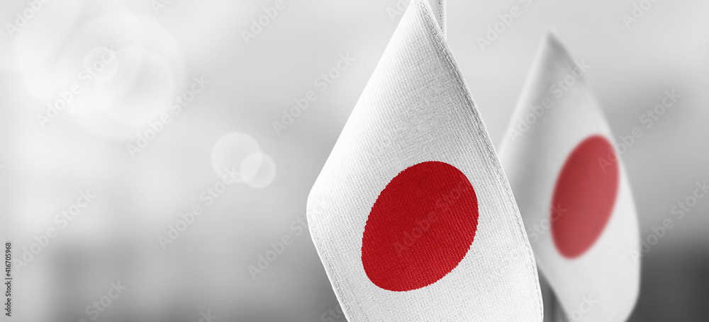 Small national flags of the Japan on a light blurry background Stock ...