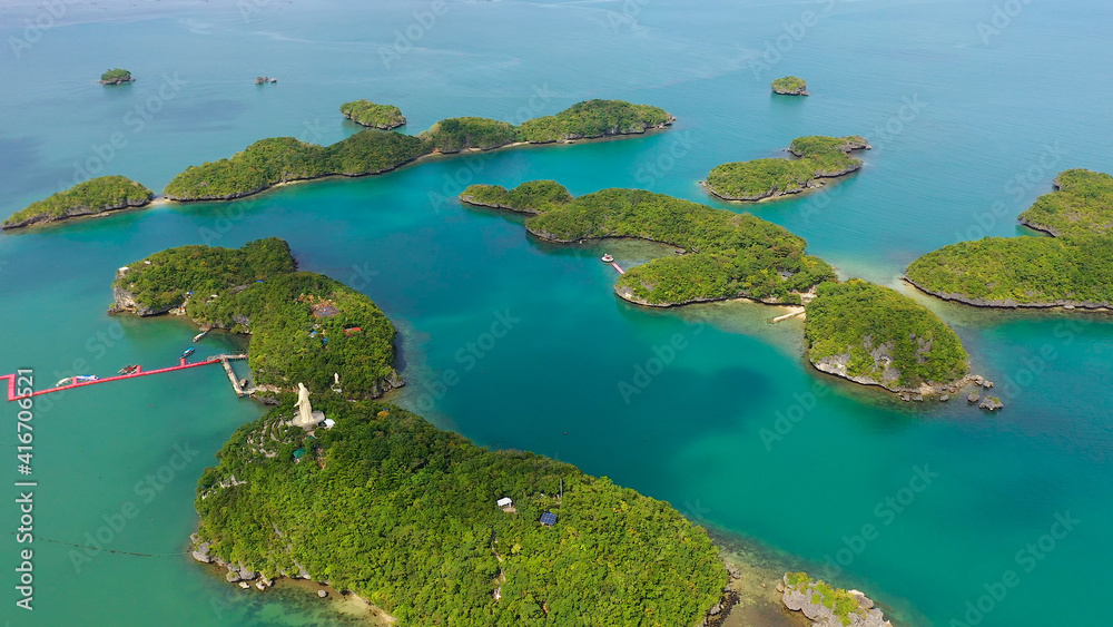 Islands in blue water covered with vegetation with beaches and bays ...