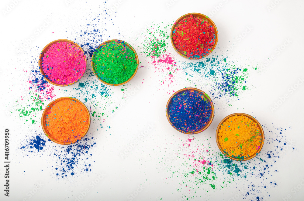 Happy Holi top view of colorful holi colors in bowls with Splash ...