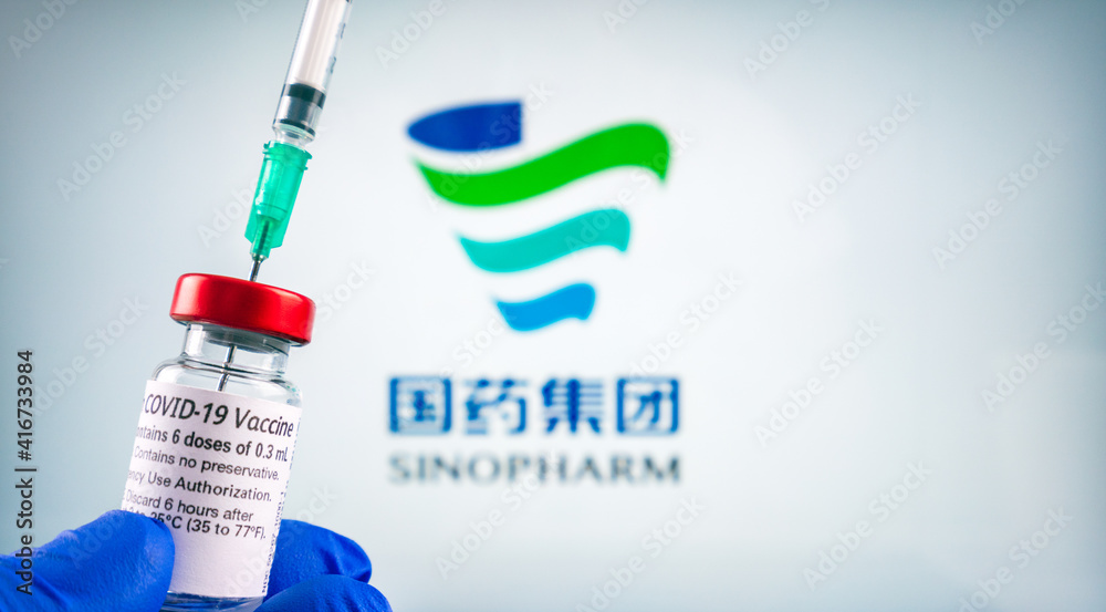 Sinopharm logo and covid-19 coronavaccine injection vial, sterile glass ...