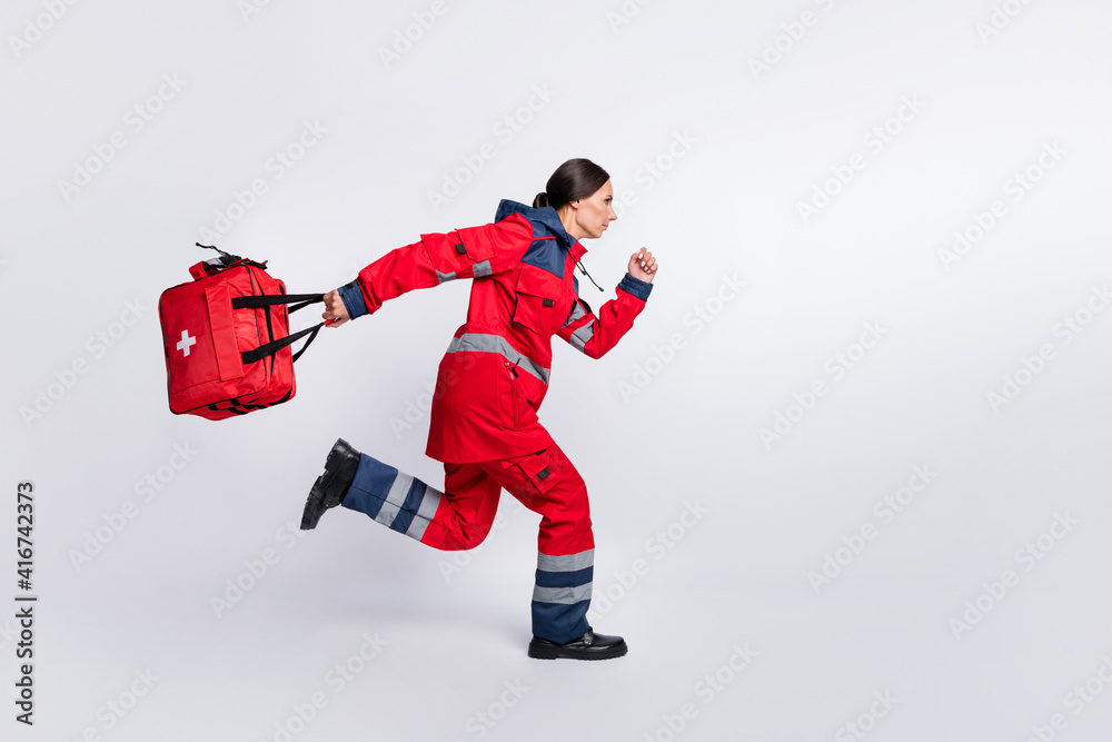 Full length body size profile side view of serious girl doc rescuer ...