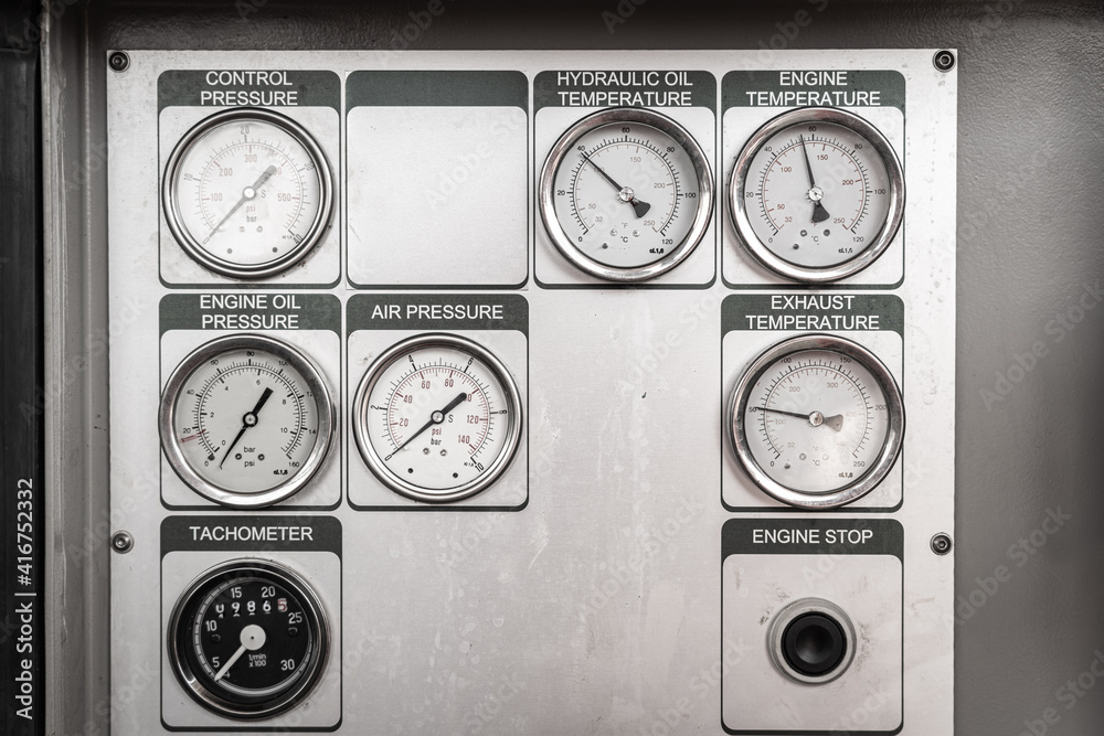 Group of of analog pressure and temperature measuring gauge on the ...