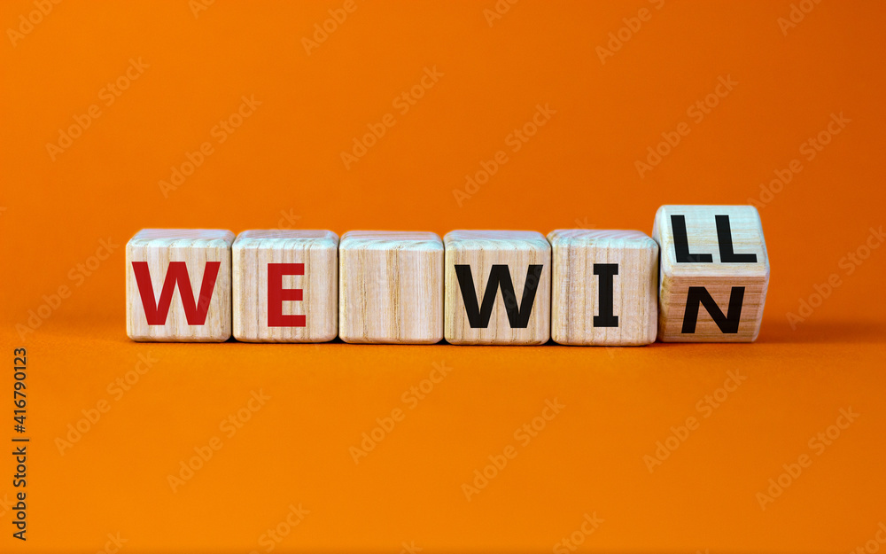 We will win symbol. Turned a wooden cube and changed words we will to ...