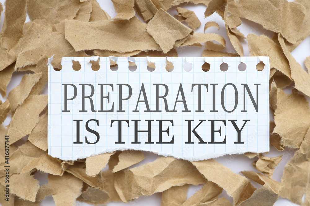 Preparation is the key. text on white paper over torn paper background ...
