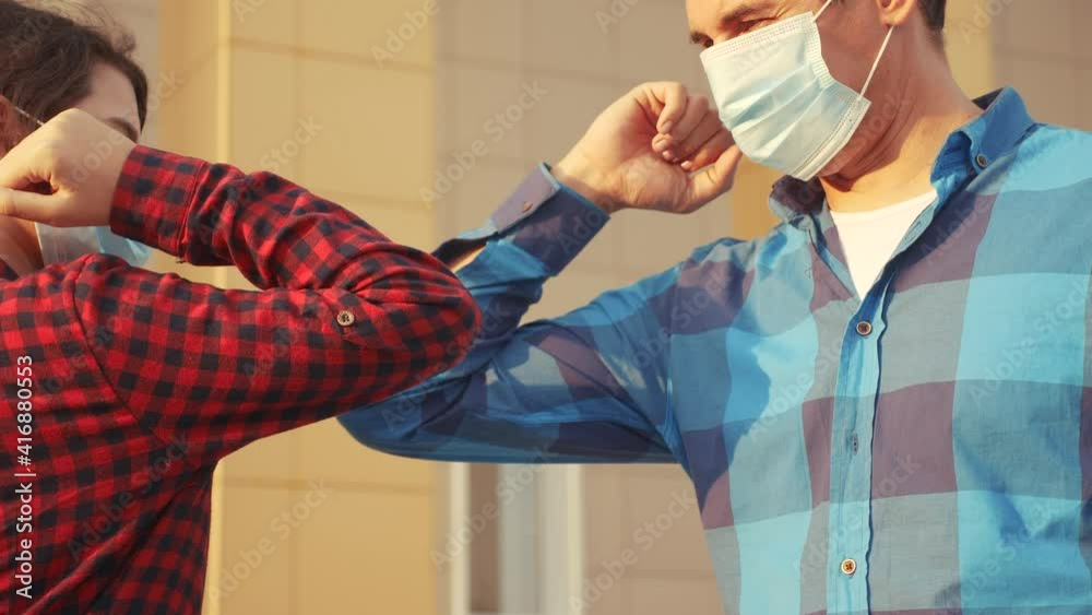 dad and daughter touch elbows social distance. bump avoid greeting ...