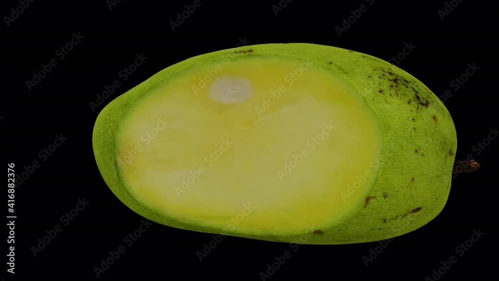 Realistic render of a spinning cut Green (Unripe) Ivory Mango on ...