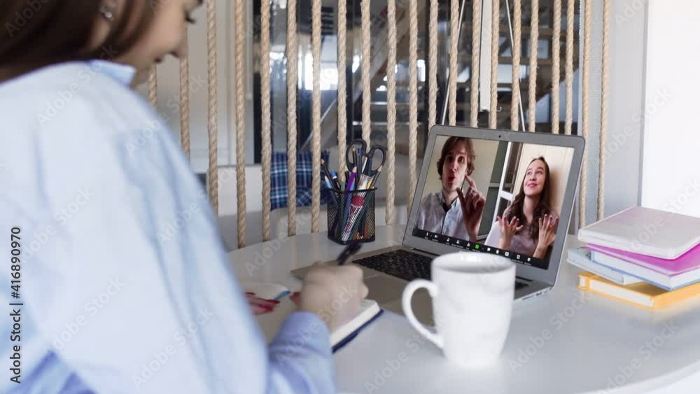 Over shoulder closeup view of remote employee conferencing in online ...