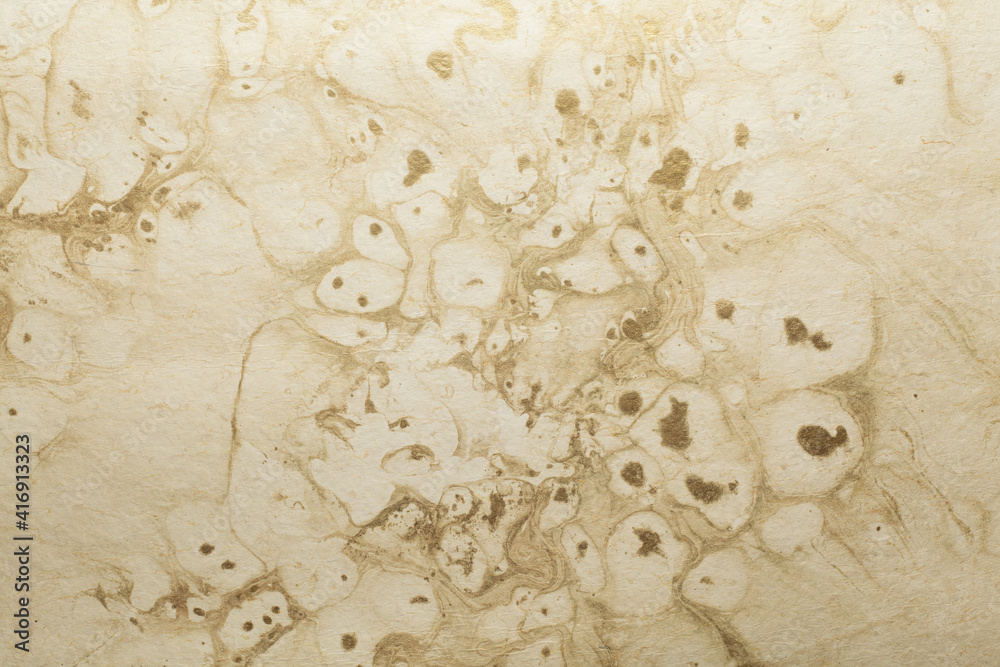 Beautiful golden yellow color handmade paper of marble texture with ...