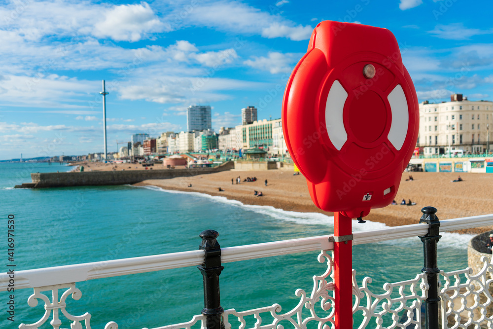 Brighton Pier bridge with Brighton beach sea, safety torus and ...