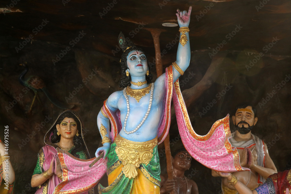 Poster Grotto with statues depicting the life of Krishna in the ...