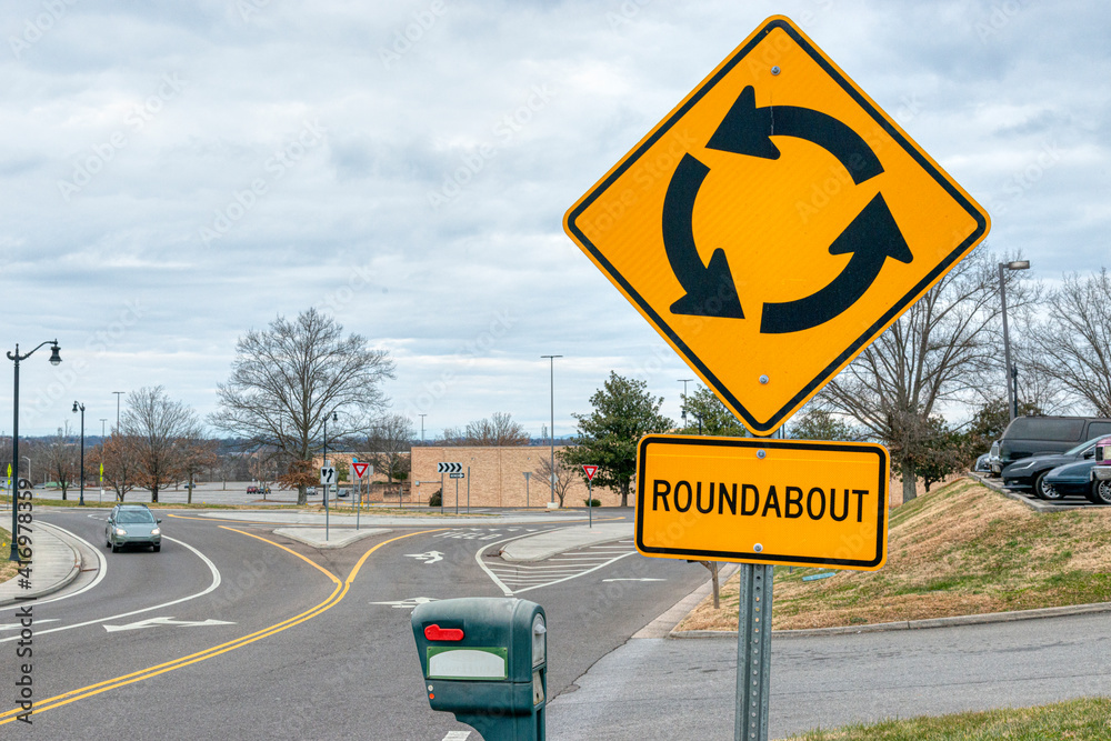 Traffic Roundabout Sign With Approaching Traffic (Disguised Vehicle ...