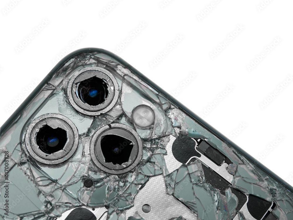 Top view the back of midnight green modern smartphone with a broken ...