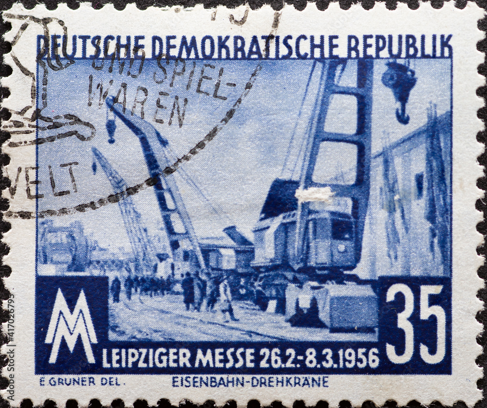 GERMANY, DDR - CIRCA 1956 : a postage stamp from Germany, GDR showing some railway cranes ...