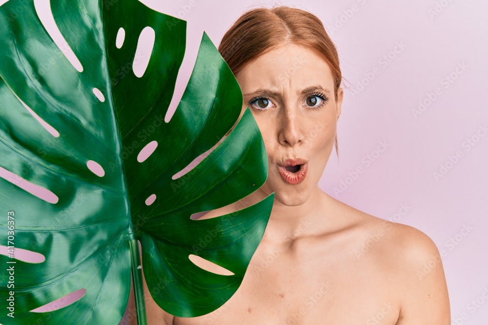 Young Irish Woman Standing Topless Showing Skin Scared And Amazed With Open Mouth For Surprise