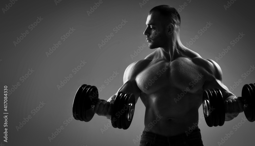 Closeup of a muscular strong well built men bodybuilder lifting ...