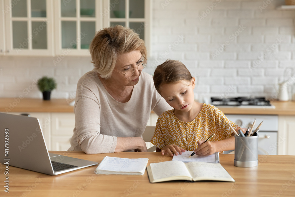 Easy learning with granny. Caring older woman grandma wearing glasses ...