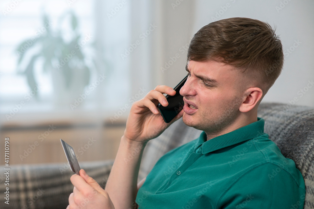 Angry disappointed furious guy young irritated man is calling to bank ...