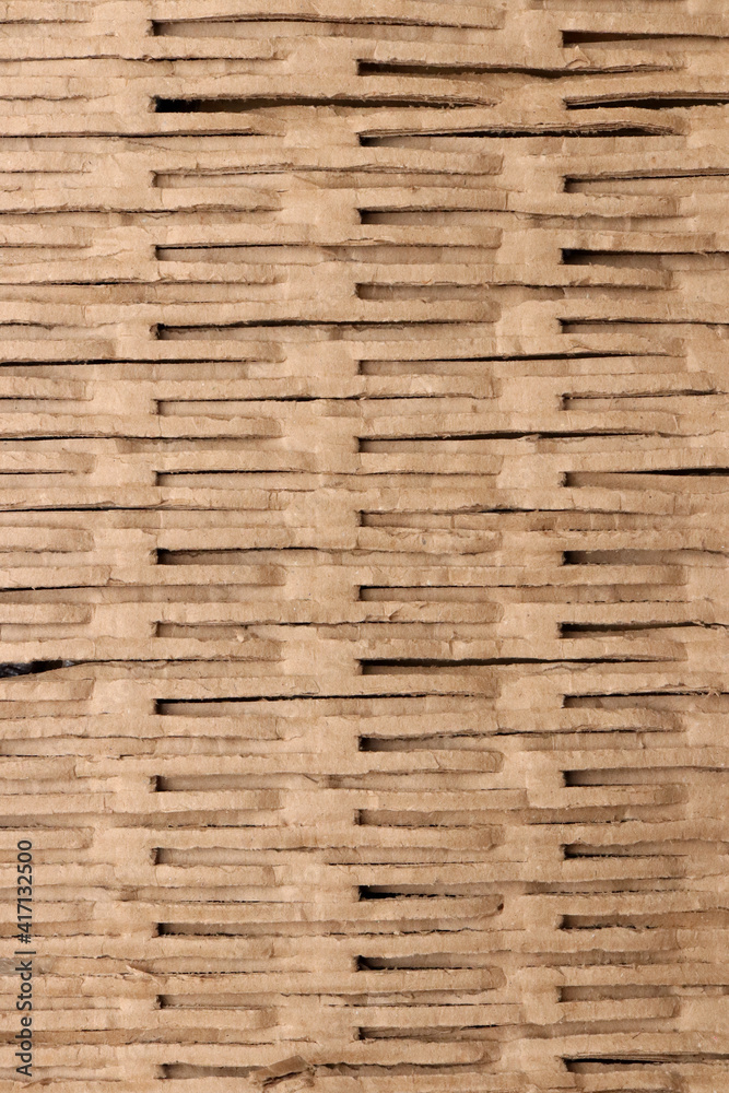 Fluted paper backdrop. Corrugated cardboard filling background. Ribbed ...