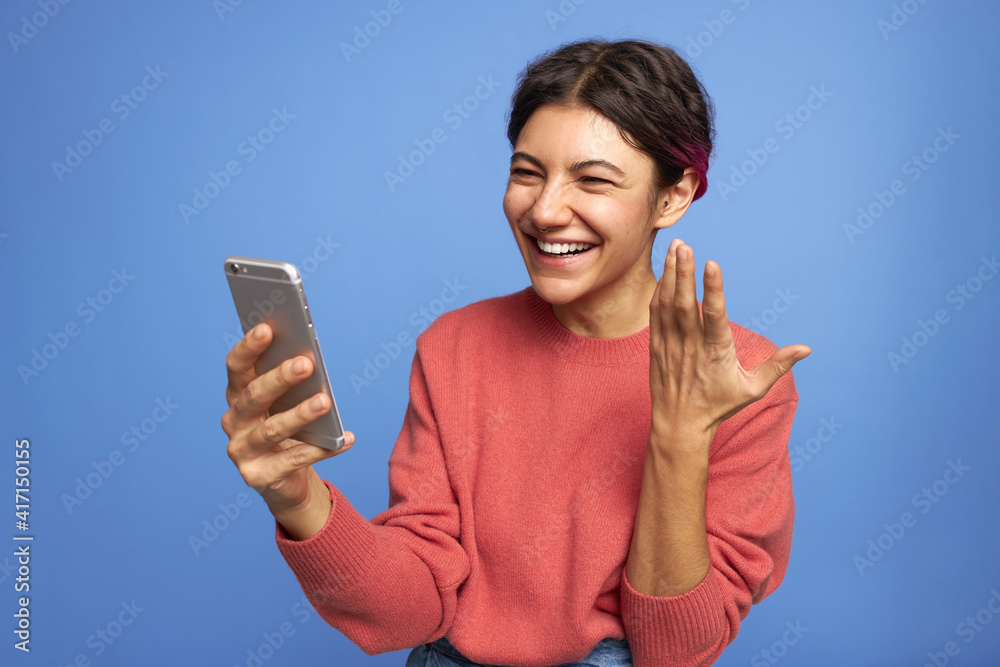 Beautiful carefree 20 year old woman holding cell phone and smiling ...