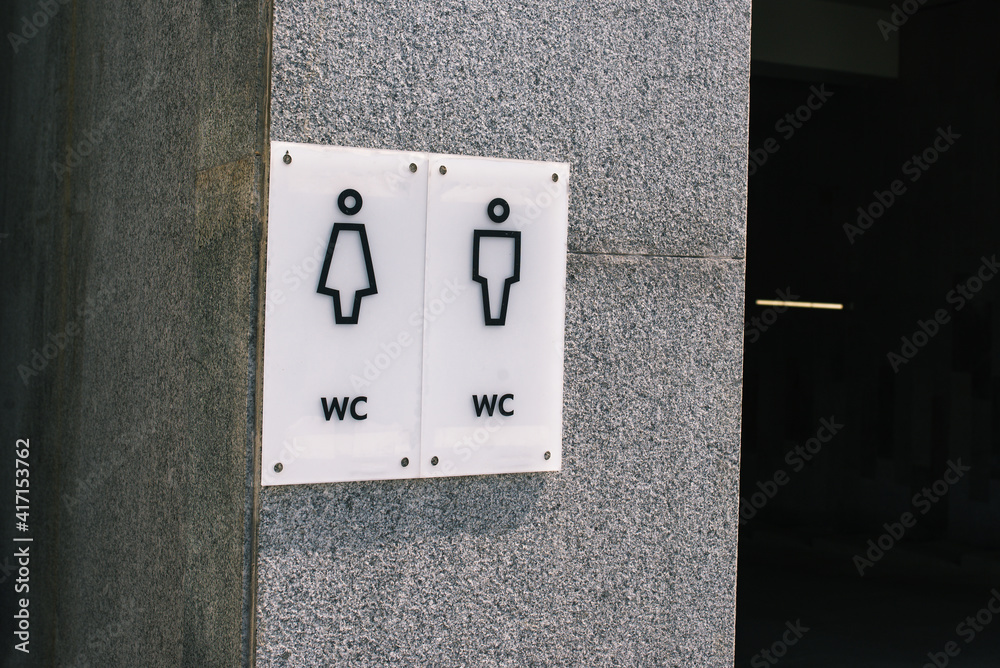 Public toilet. Signboard with the inscription male and female toilet ...