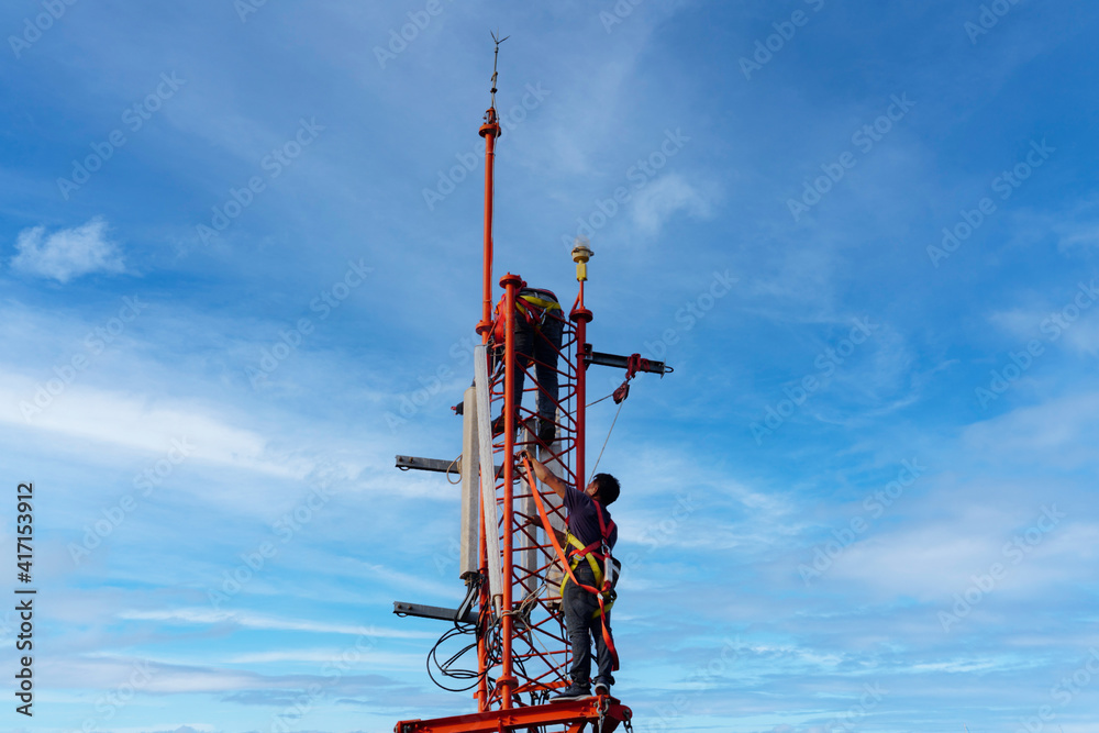 Engineer maintenance on telecommunication tower doing ordinary ...