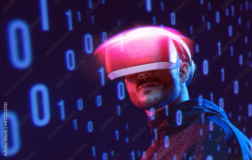 Man on dark virtual reality background. Guy using VR helmet. Augmented ...