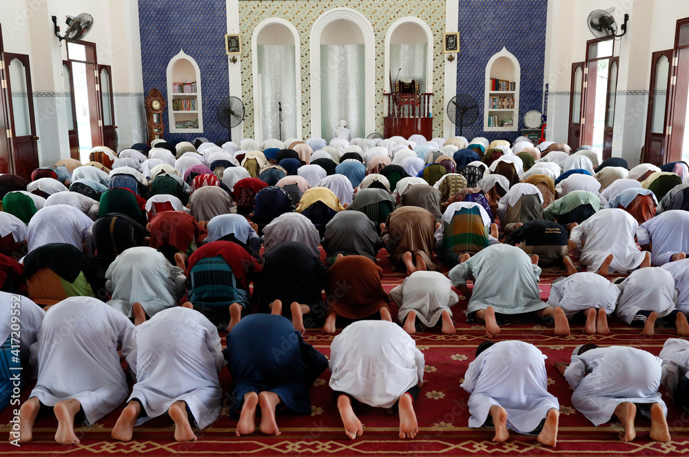 Masjid Ar-Rohmah mosque. Men at the friday prayer (salat). Chau Doc ...
