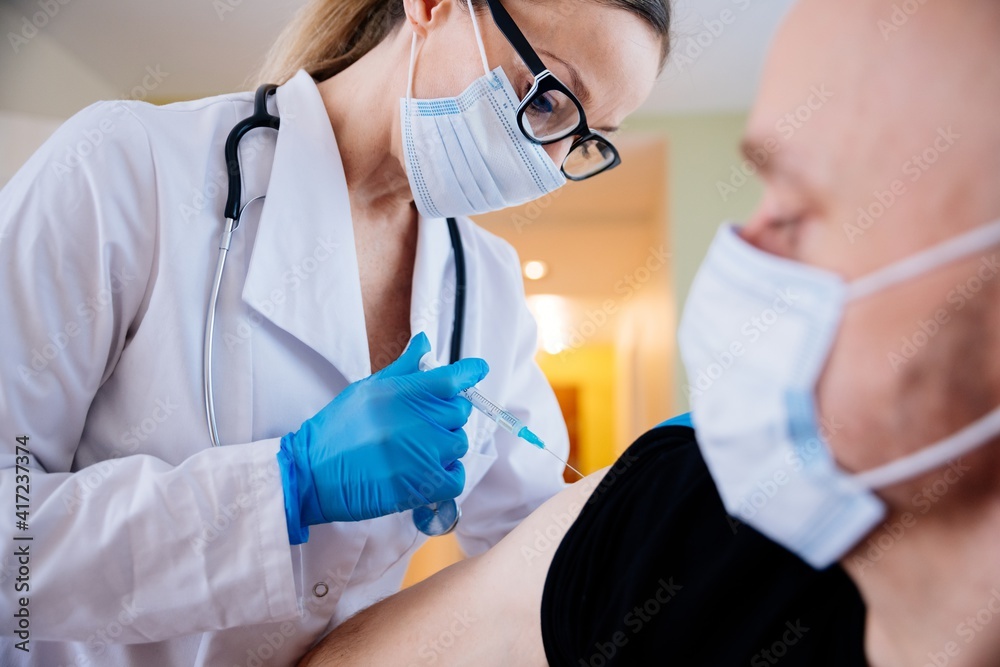 Doctor injecting vaccine into patient arm. Covid-19 or Coronavirus ...