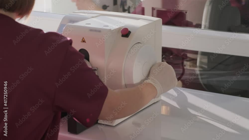 The laboratory assistant makes histological research, microtoming ...