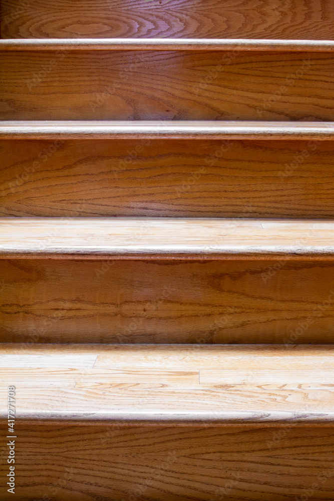 Wooden staircase leading up; Parallel horizontal lines of ascending ...